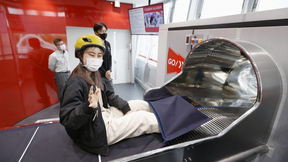 60-meter-long spiral slide opens at Osaka's iconic Tsutenkaku Tower ...