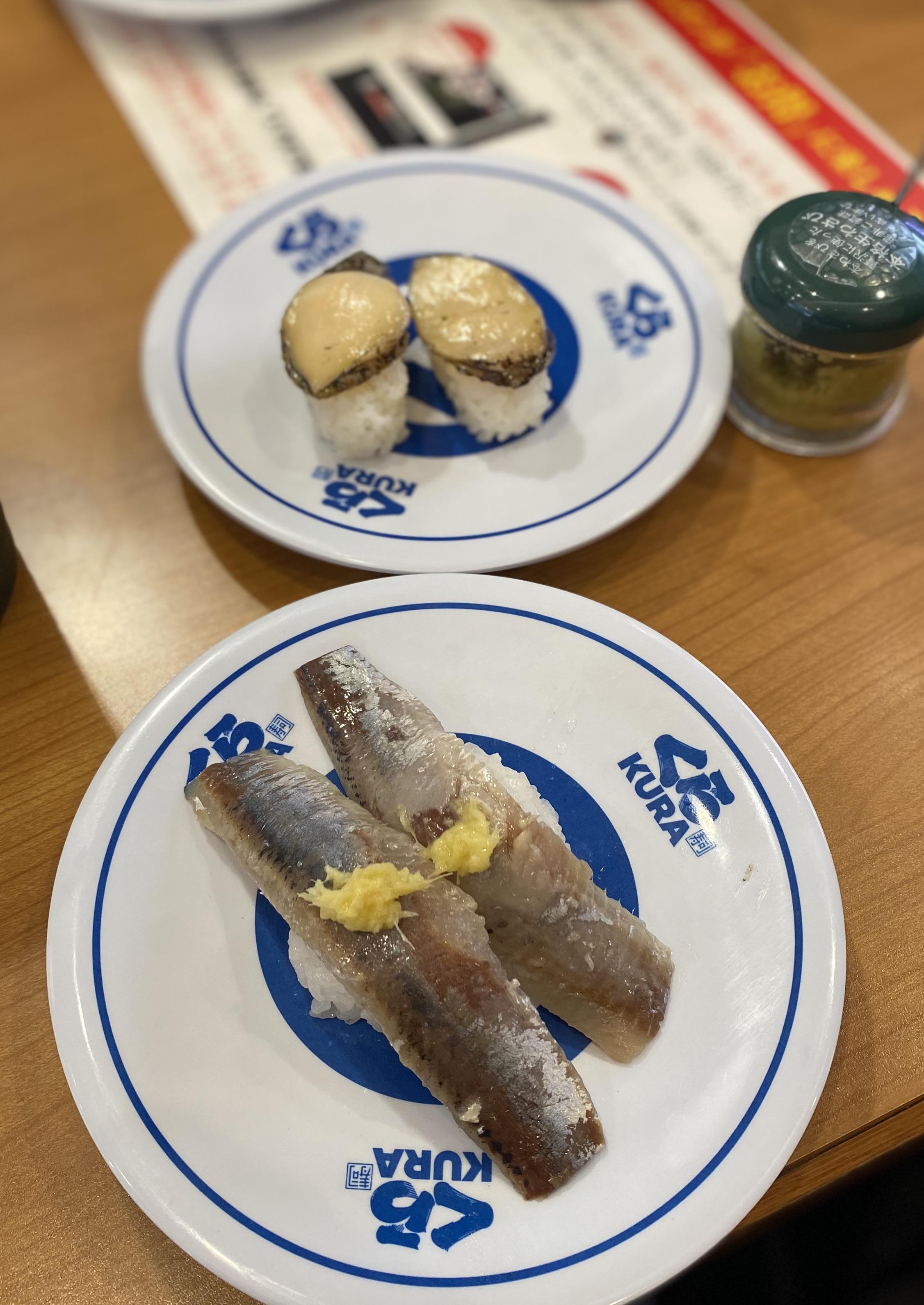 Iwashi and awabi sushi at Kura Sushi - Lonely Japan