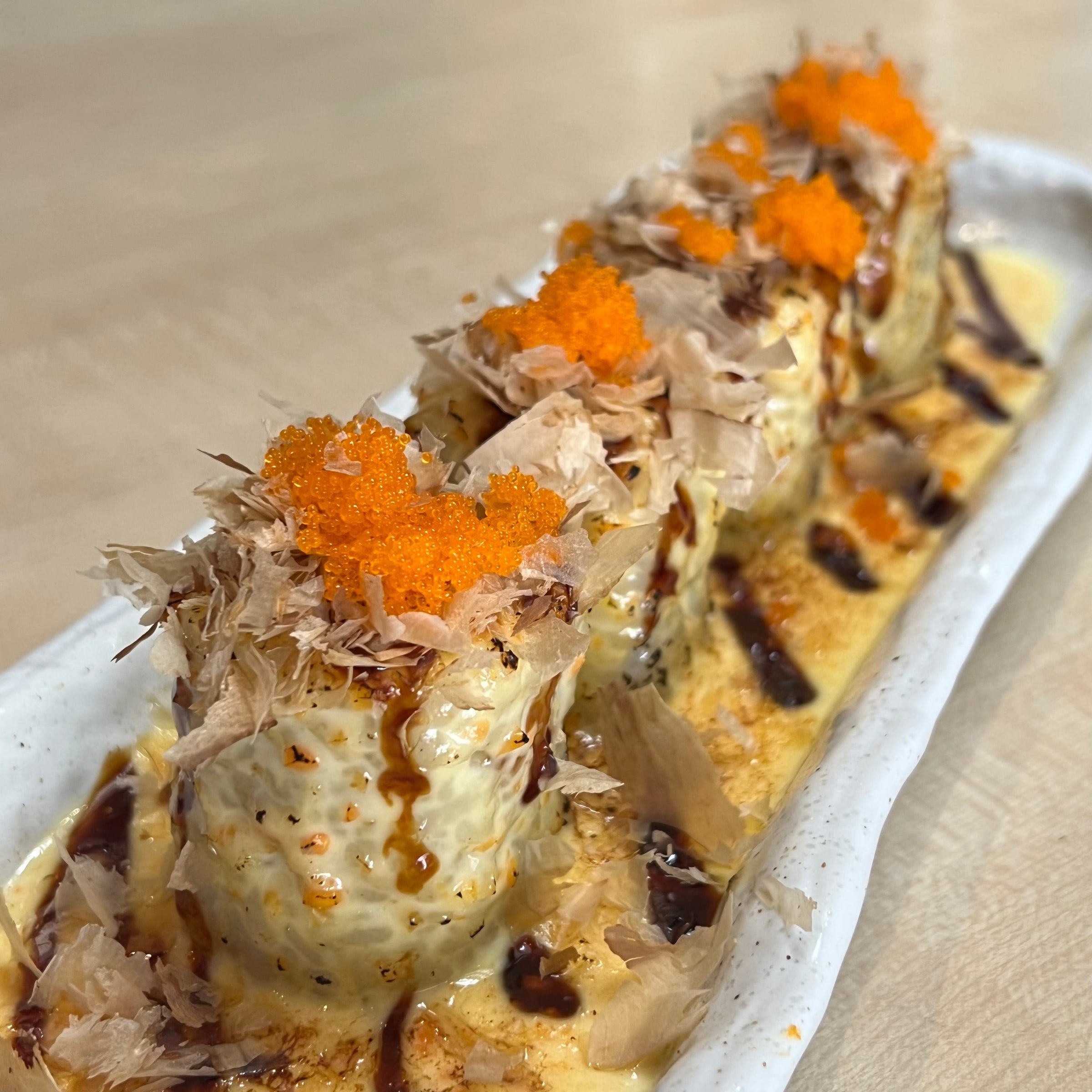 What is the sauce used in this dish likely to be? ('Volcano roll ...